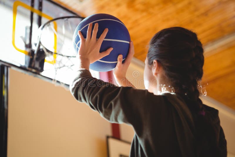 Side View of Young Woman Practicing Basketball in Court Stock Image ...