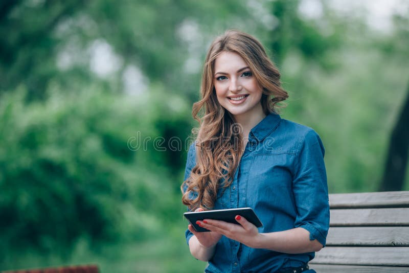 Side View of a Young Woman Using Tablet Computer Stock Image - Image of ...