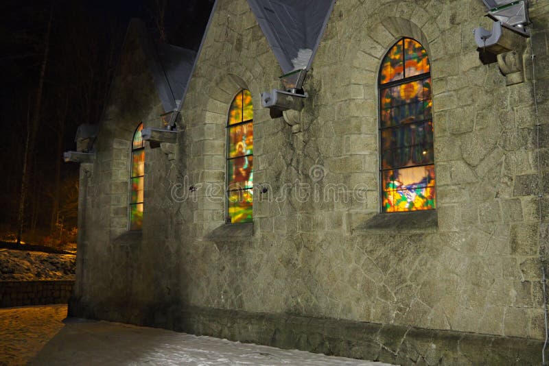 Side Wall Of A Stone Church With Stained-glass Windows Stock Photo ...