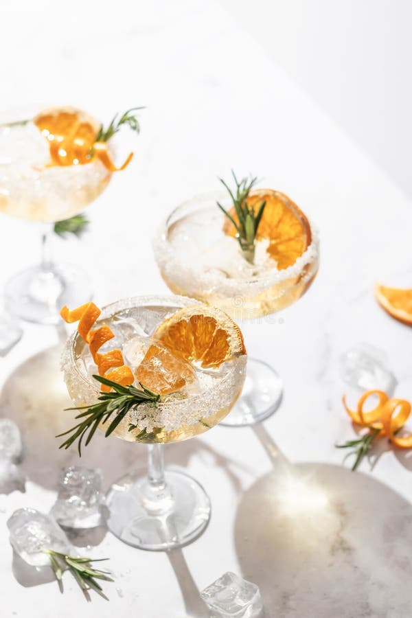 Two Sidecar Cocktails with Sugar Rims on White Marble Table. Festive ...