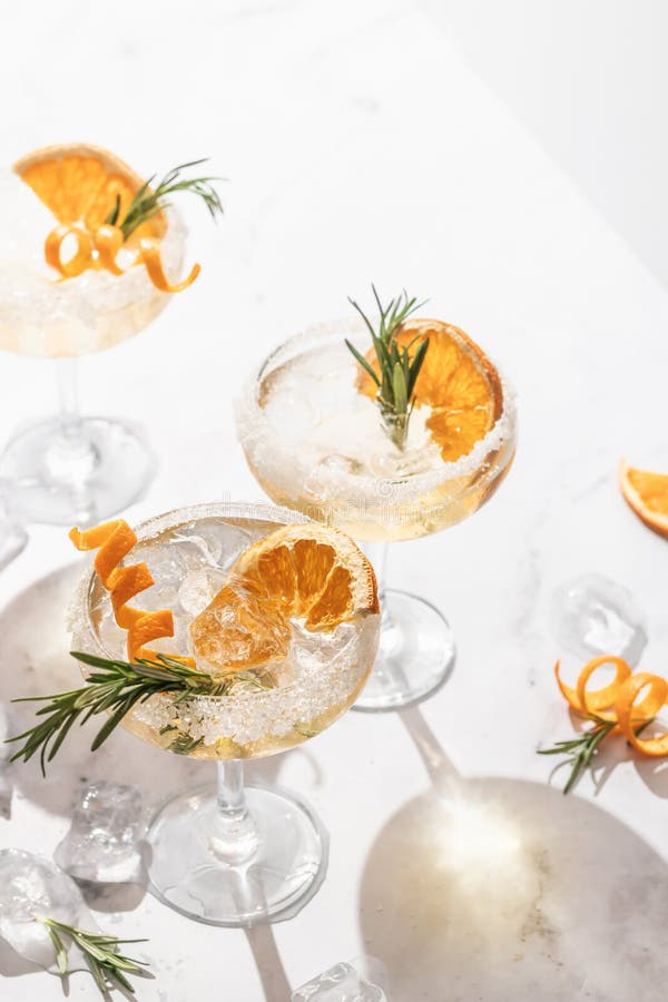 Two Sidecar Cocktails with Sugar Rims on White Marble Table. Festive ...