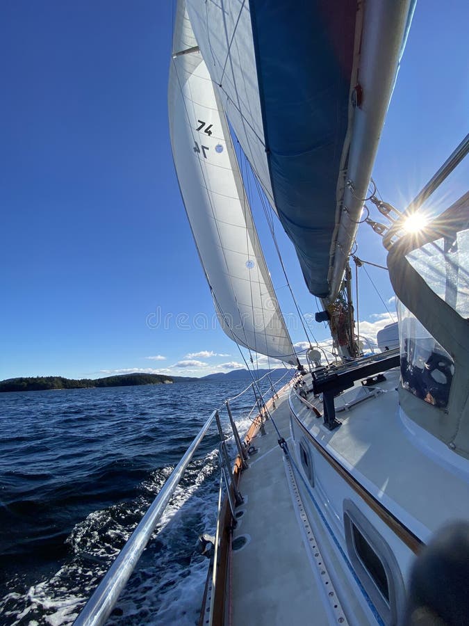 Sideview of Sailboat Sailing Along Stock Photo - Image of sailboat ...