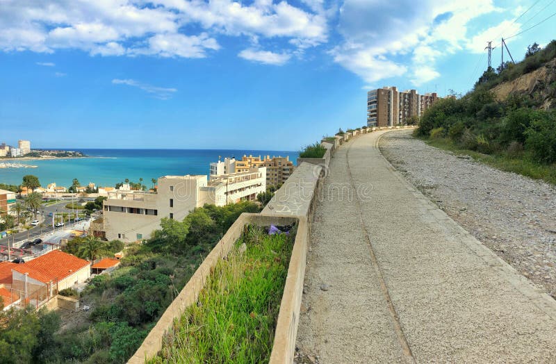 Sidewalk with a Beautiful Seascape View and Seaside Buildings Stock ...