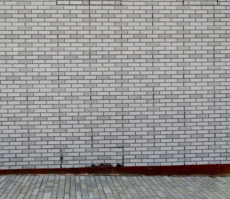 Sidewalk in Front of a Brick Wall Stock Image - Image of material ...