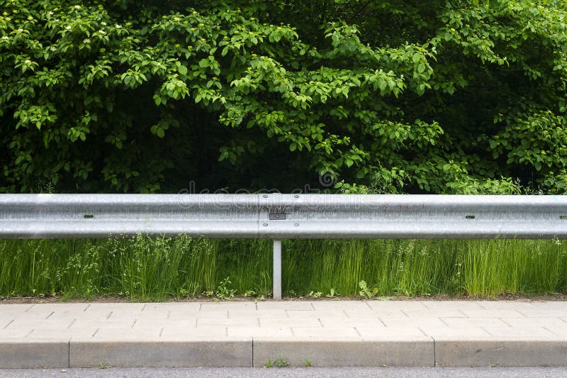 Sidewalk, Highway Guard Rail, Green Grass and Bushes Stock Image ...