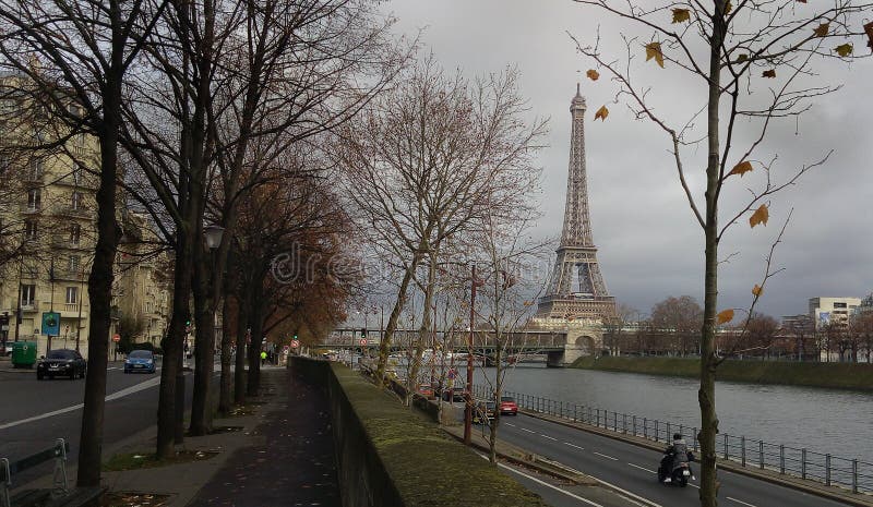 Sidewalk Next To the Sena River with View of the Eiffel Tower in Paris ...