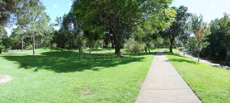 Sidewalk through park stock image. Image of running, plant - 2866261