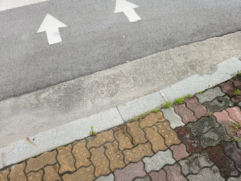 Sidewalk and Texture of the Asphalt Road with an Arrow Stock Image ...