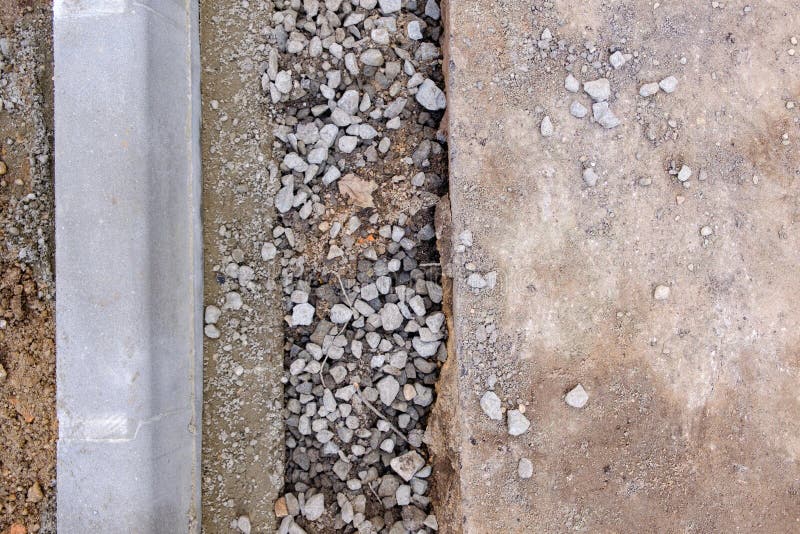 A Sidewalk is Under Construction, a Concrete Curb is Being Installed ...