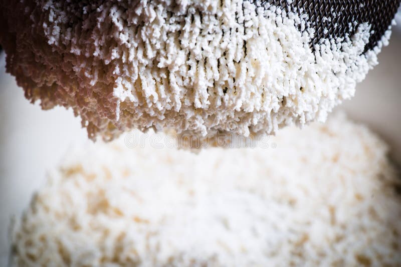 Sieve with cheese. Macro. stock image. Image of sieve - 146414403