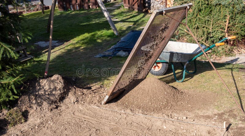 Sieve Garden Soil into a Compost Heap Stock Image - Image of humus ...
