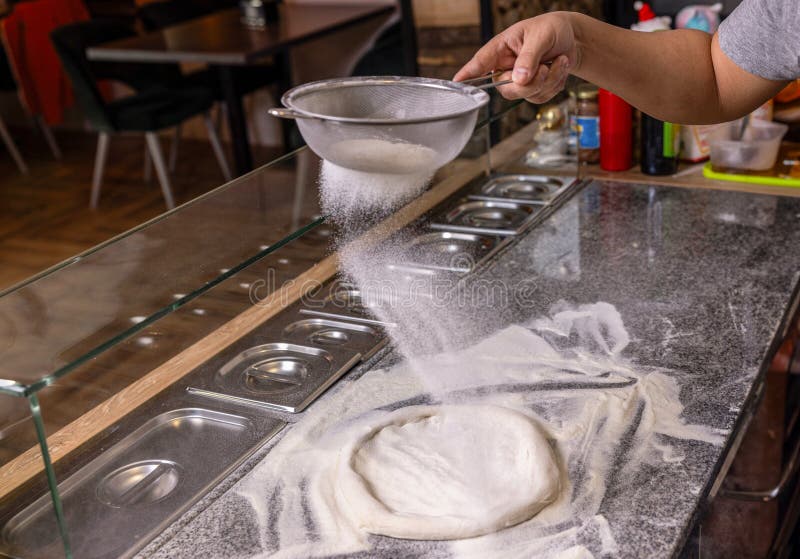 Sift Flour by Sieve with the Flour for Beating Up Dough, Pizza. Hands ...