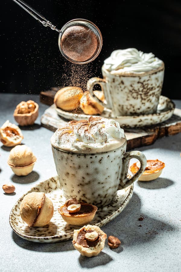 Sifting Cocoa Powder on Cup of Tasty Cocoa Drink, Vertical Image. Top ...