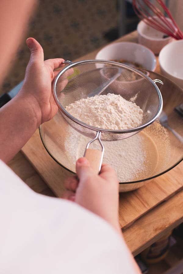 Sifting flour stock image. Image of ingredient, cooking - 183194459