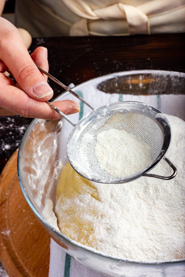 Sifting Flour through a Sieve. Dough Preparation Process. Workflow in a ...