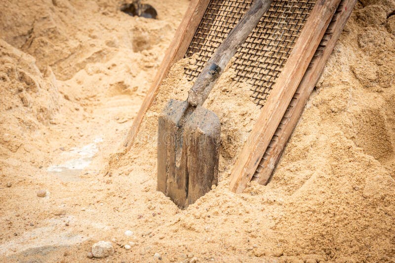 Sifting Sand through a Grid at a Construction Site Stock Photo - Image ...