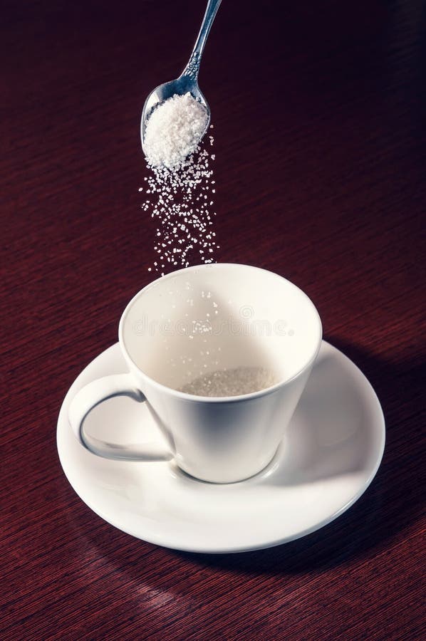 Sifting sugar in the cup stock photo. Image of drop, heap - 53446278
