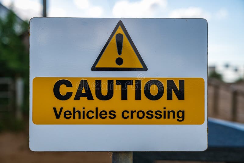 Caution Vehicles Crossing Sign. Stock Photo - Image of crossing, sign ...