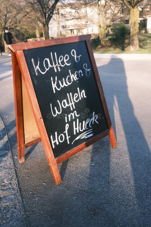 A Sign for a Coffee Shop with a Chalkboard on it Stock Photo - Image of ...