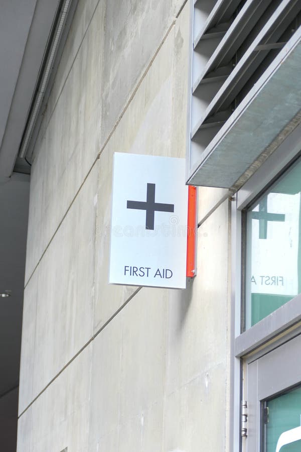 First Aid Sign on Building Facade Stock Photo - Image of outdoor ...