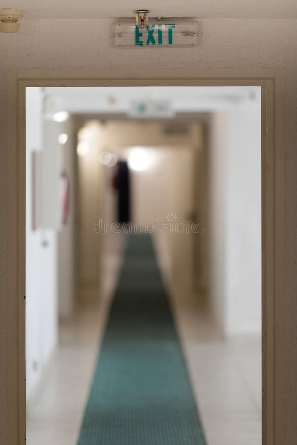 Emergency Exit Sign In Hallway Stock Image - Image of interior, hallway ...