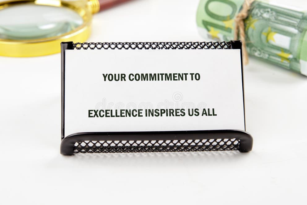 A Sign Emphasizes the Importance of Commitment To Excellence in a ...