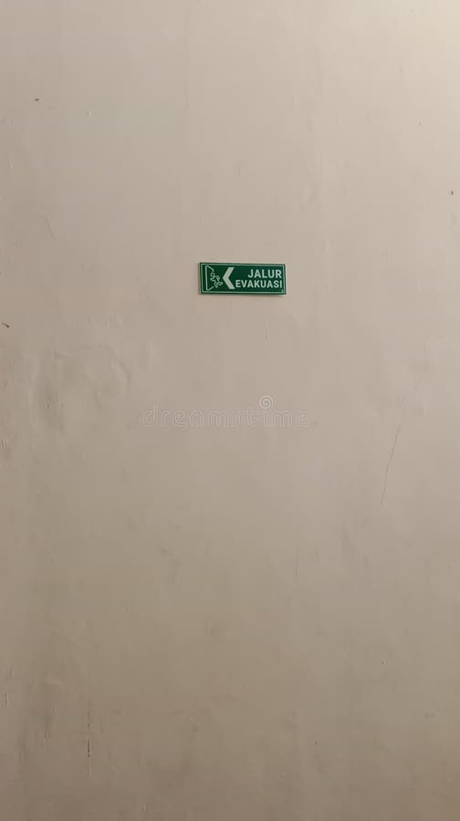 A Sign for the Escape Route on the Wall Stock Photo - Image of sketch ...