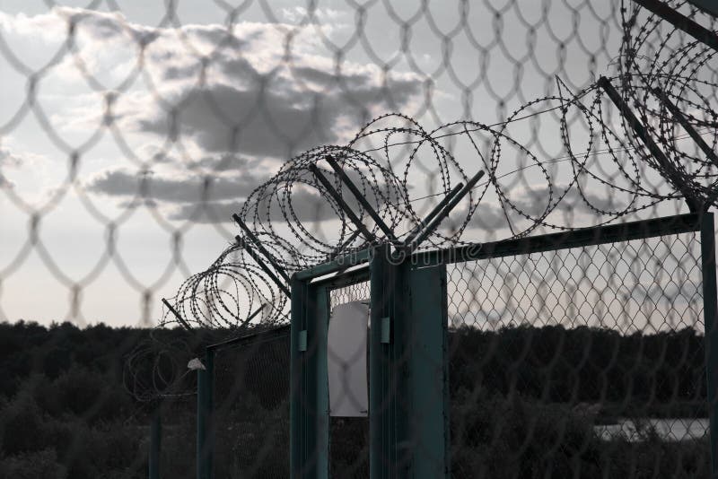 Sign on a Fence with Barbed Wire Stock Photo - Image of border, closeup ...