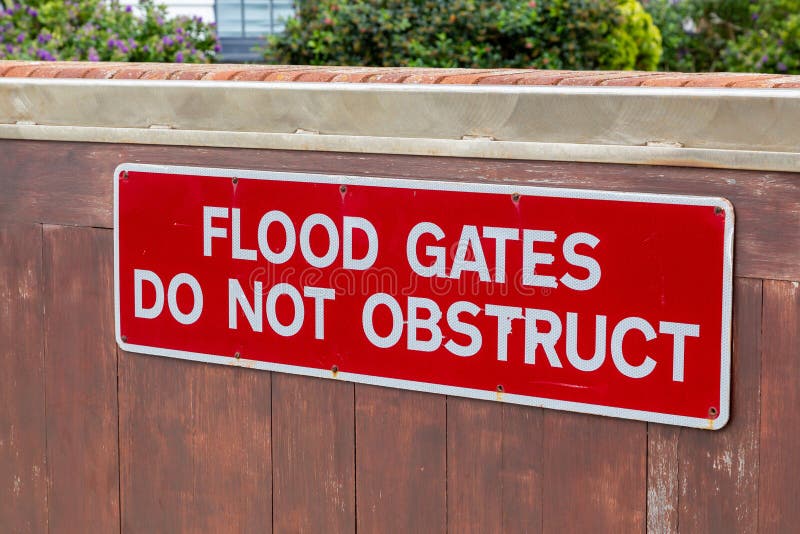 A Sign on a Flood Gate that Reads Flood Gates Do Not Obstruct Stock ...