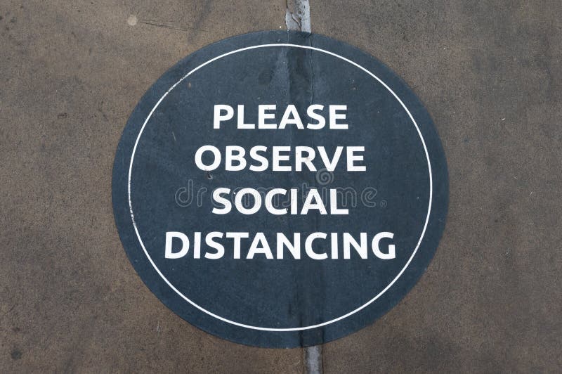 A Sign on the Floor Asking People To Observe Social Distancing Rules ...