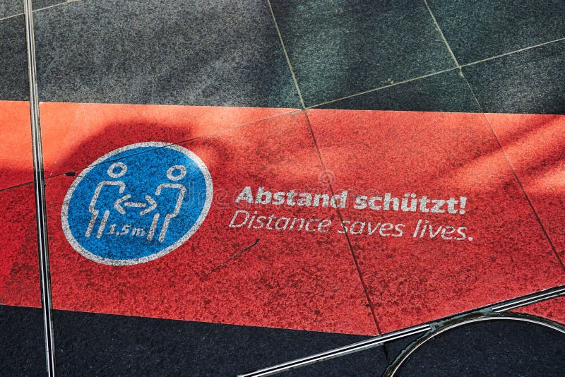 Sign on the Floor Stating that a Minimum Distance Must Be Observed ...