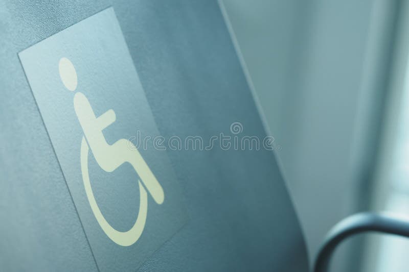A Sign Indicating Accessible Seating for Passengers with Disabilities ...