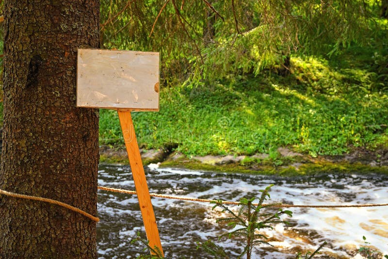 Sign for Inscription in Forest on Background of River Stock Photo ...