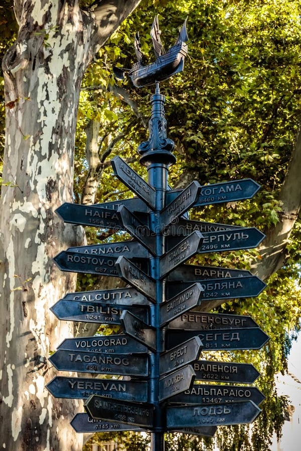 A Sign with Many Different Directions on it Stock Image - Image of ...