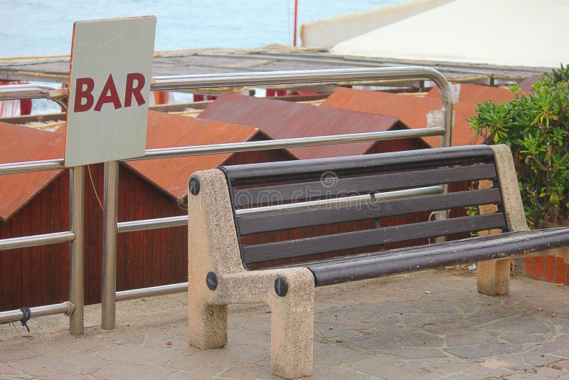 Sign Near a Bench at the Sea Stock Photo - Image of bench, sign: 73959644
