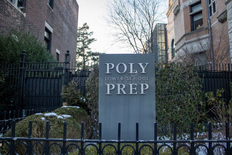 A Sign Next To a Fence in a Yard with Some Bushes Editorial Stock Image ...