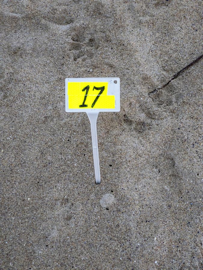 Sign with the Number 17 at Sandy Beach Stock Photo - Image of town ...
