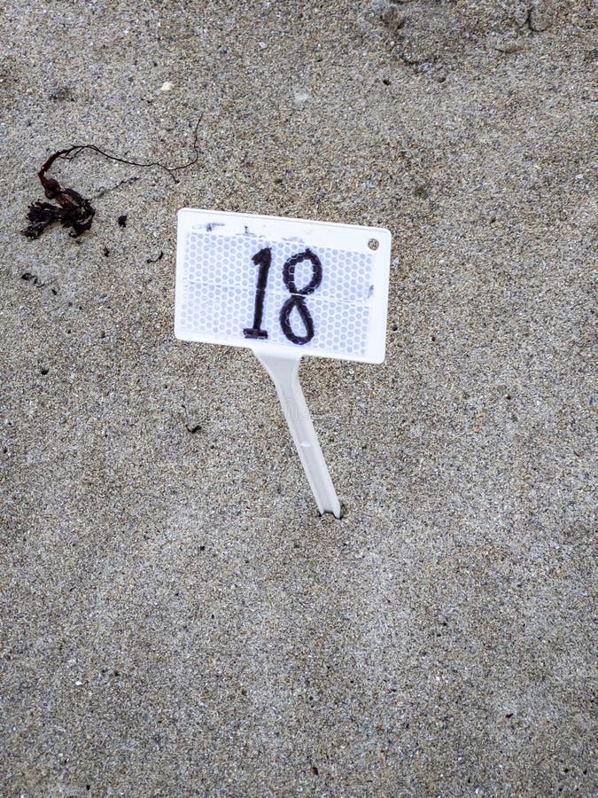 Sign with the Number 18 at Sandy Beach Stock Image - Image of eightteen ...