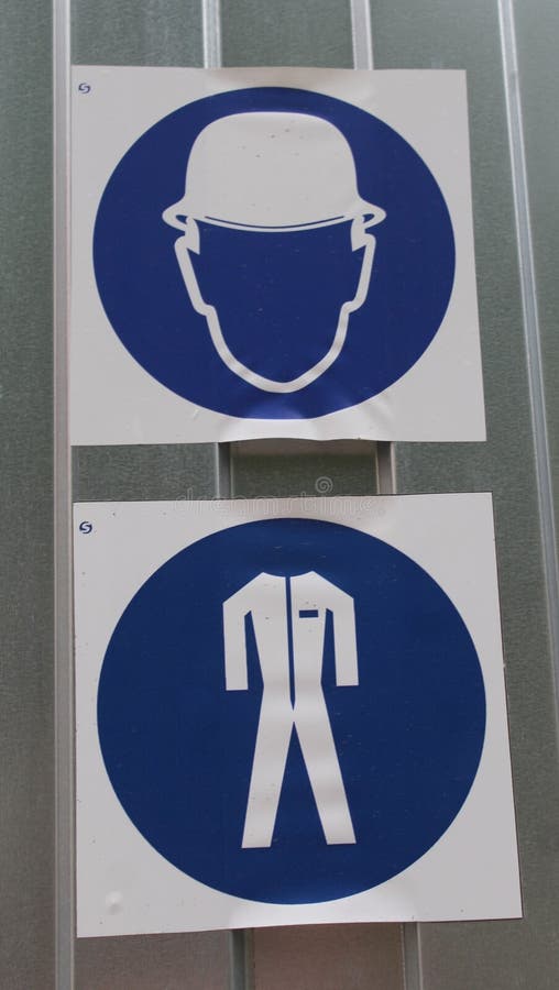 Sign with Obligation To Use Mask and Work Overalls Stock Photo - Image ...