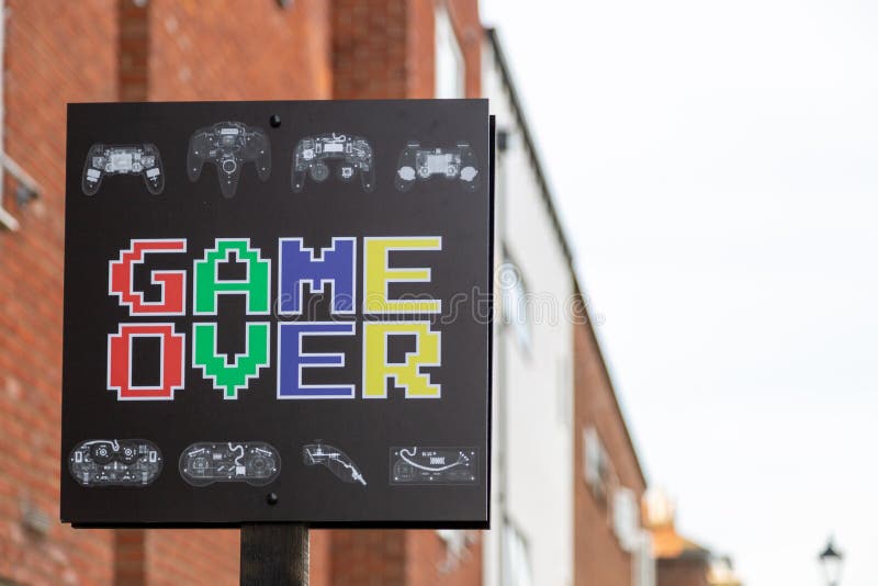 A Sign Outside a Building with the Words Game Over on it in Computer ...