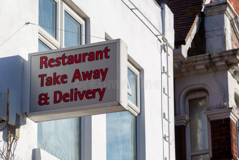 A Sign Outside a Takeaway Restaurant Stating Restaurant Takeaway and ...