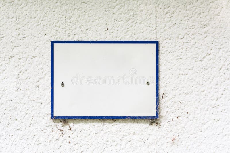 Sign or Panel Mounted with Blue Border without Inscription on a Wall ...