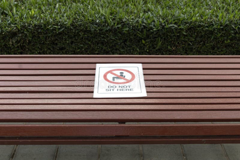 A Sign on a Park Bench "do Not Sit Here Stock Image - Image of wooden ...