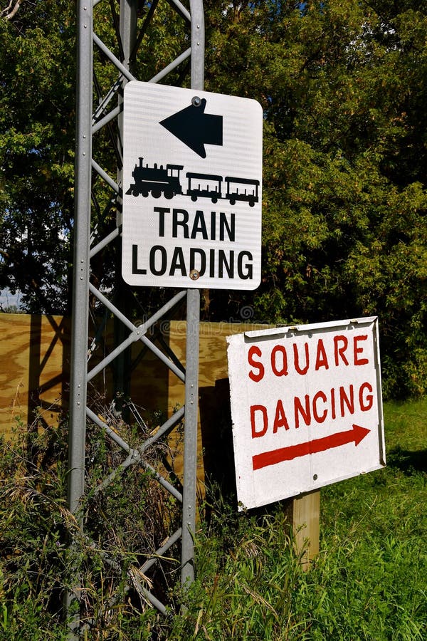 Train Loading and Square Dancing Signs Stock Image - Image of signage ...