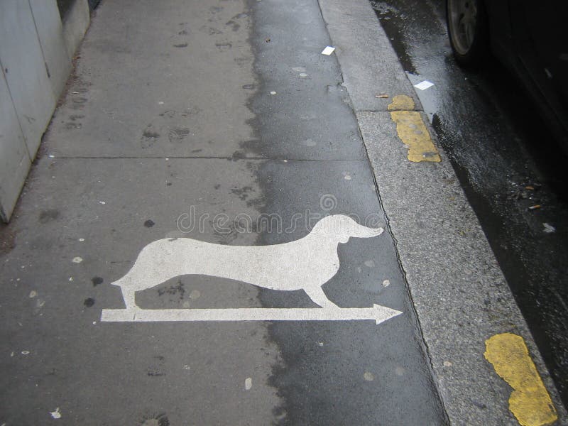 Sign on pavement in Paris stock photo. Image of dirt - 83832752