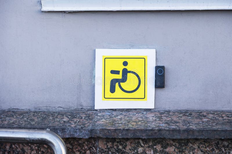 Sign Plate for Disabled People on the Wall of the Building Stock Photo ...