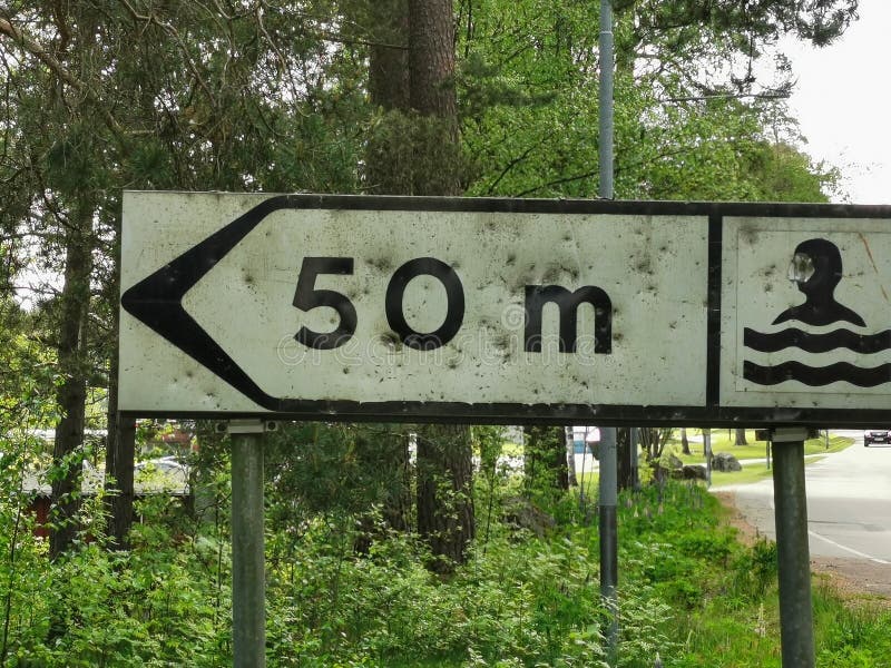 Sign Post for Beach in Sweden Stock Image - Image of highway, swim ...