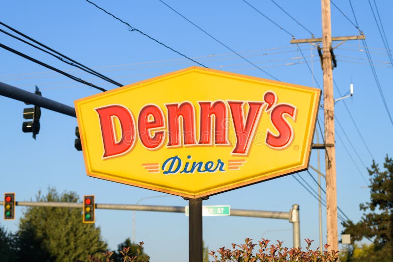 Signpost for Denny`s Diner in the Glow of the Setting Sun Editorial ...