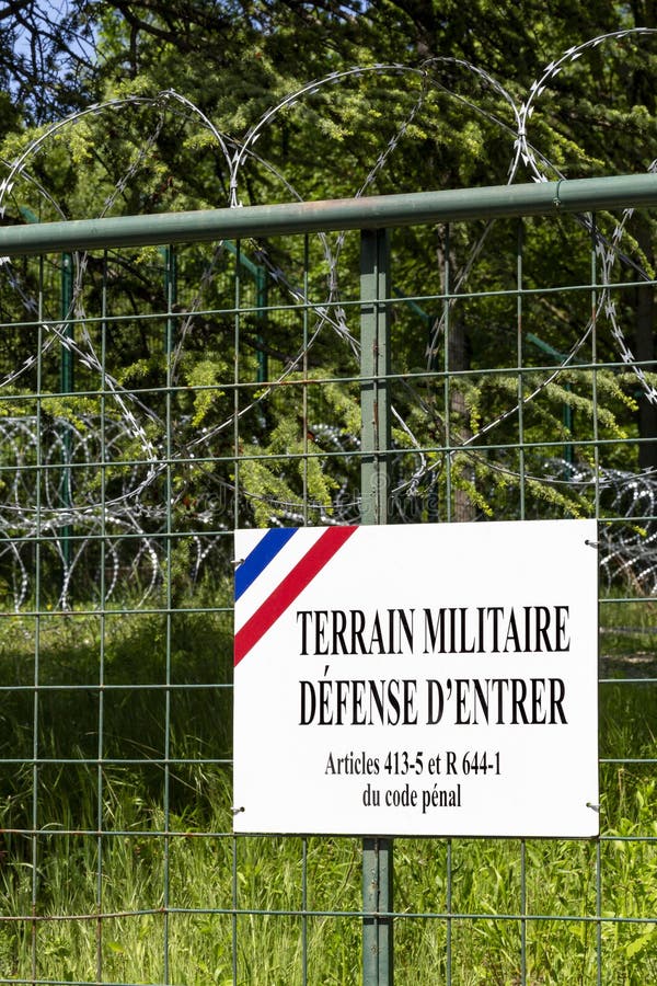 Close Up Of A No Trespassing Sign With A Fence Background Sign Prohibitionof Entry On A