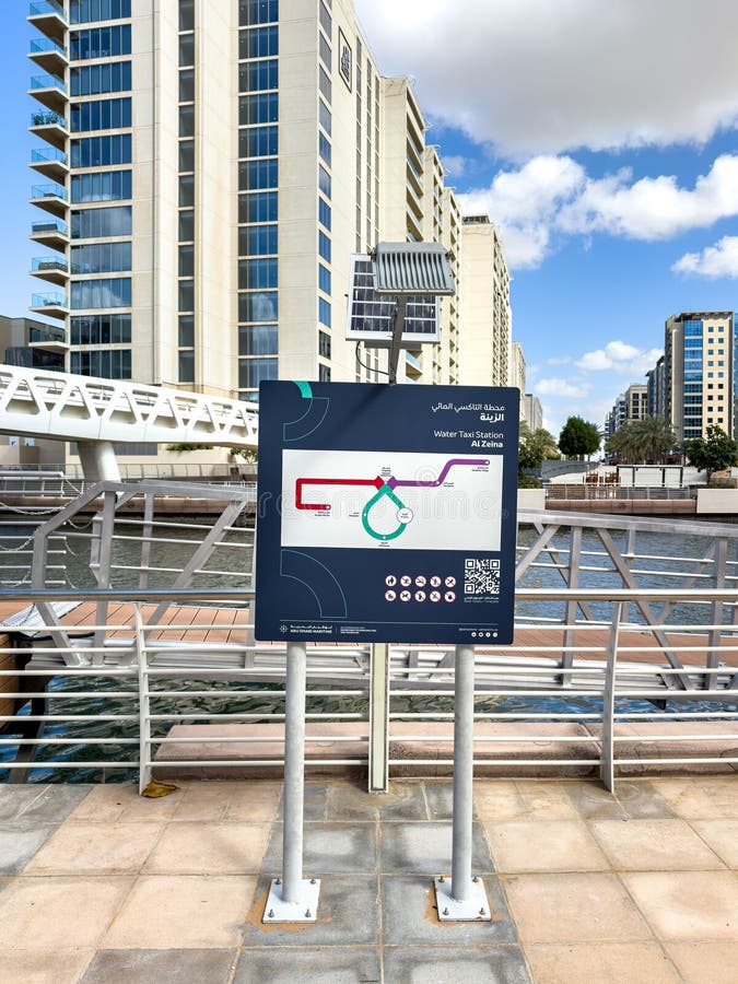 Sign for a Public Transportation System on the Sidewalk of a Bridge ...